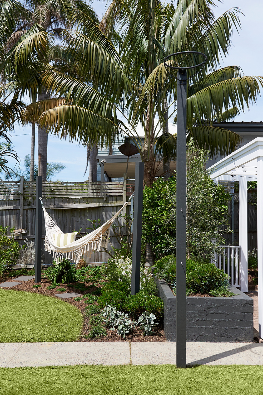 How to hang a hammock with posts | Better Homes and Gardens