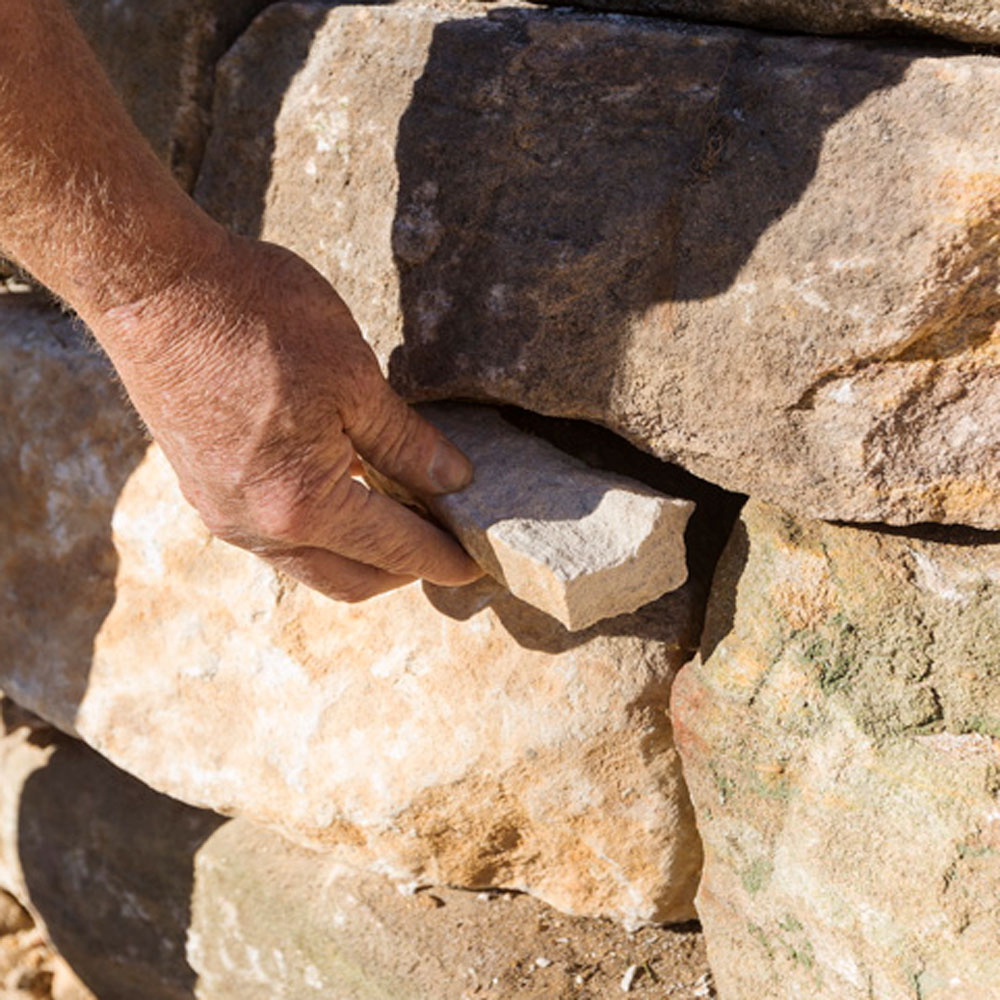 How to build a stacked sandstone wall | Better Homes and Gardens